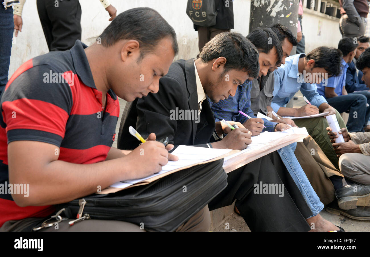 Dhaka, Bangladesh. 12th Feb, 2015. Bangladeshi jobseekers fill in forms ...