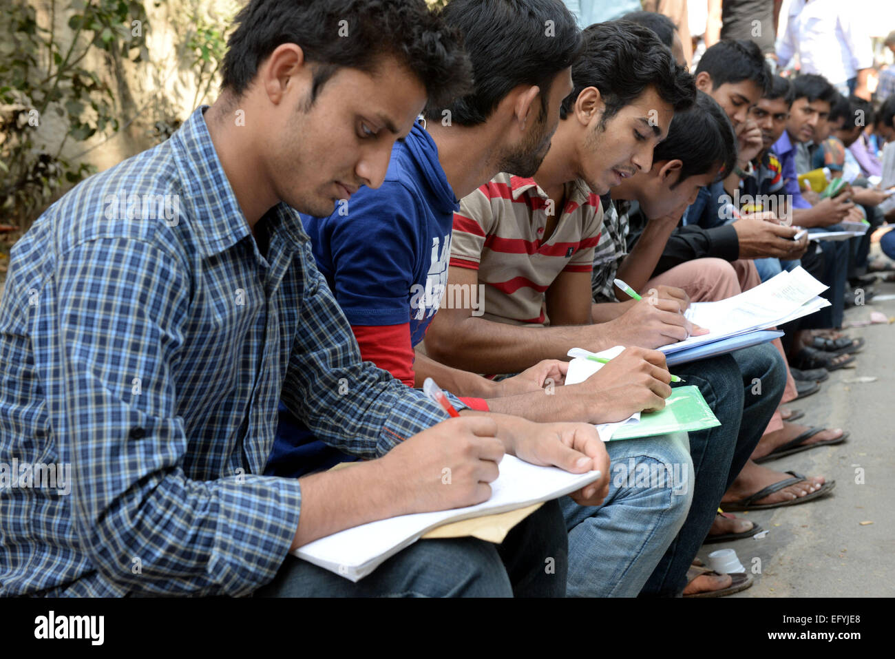 Dhaka, Bangladesh. 12th Feb, 2015. Bangladeshi jobseekers fill in forms ...