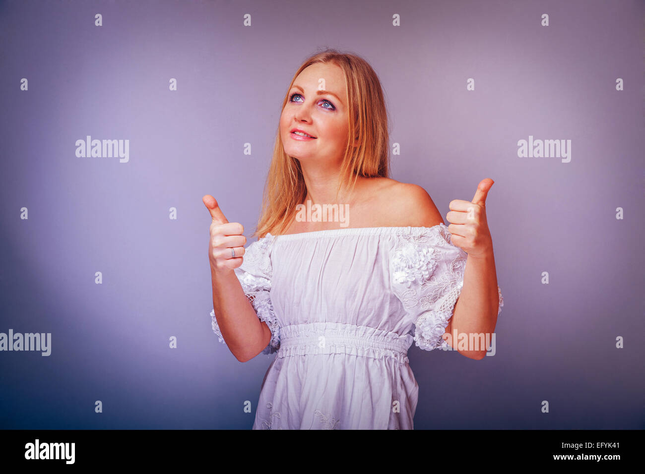 European-looking woman of thirty years thumbs up gesture yes on Stock ...