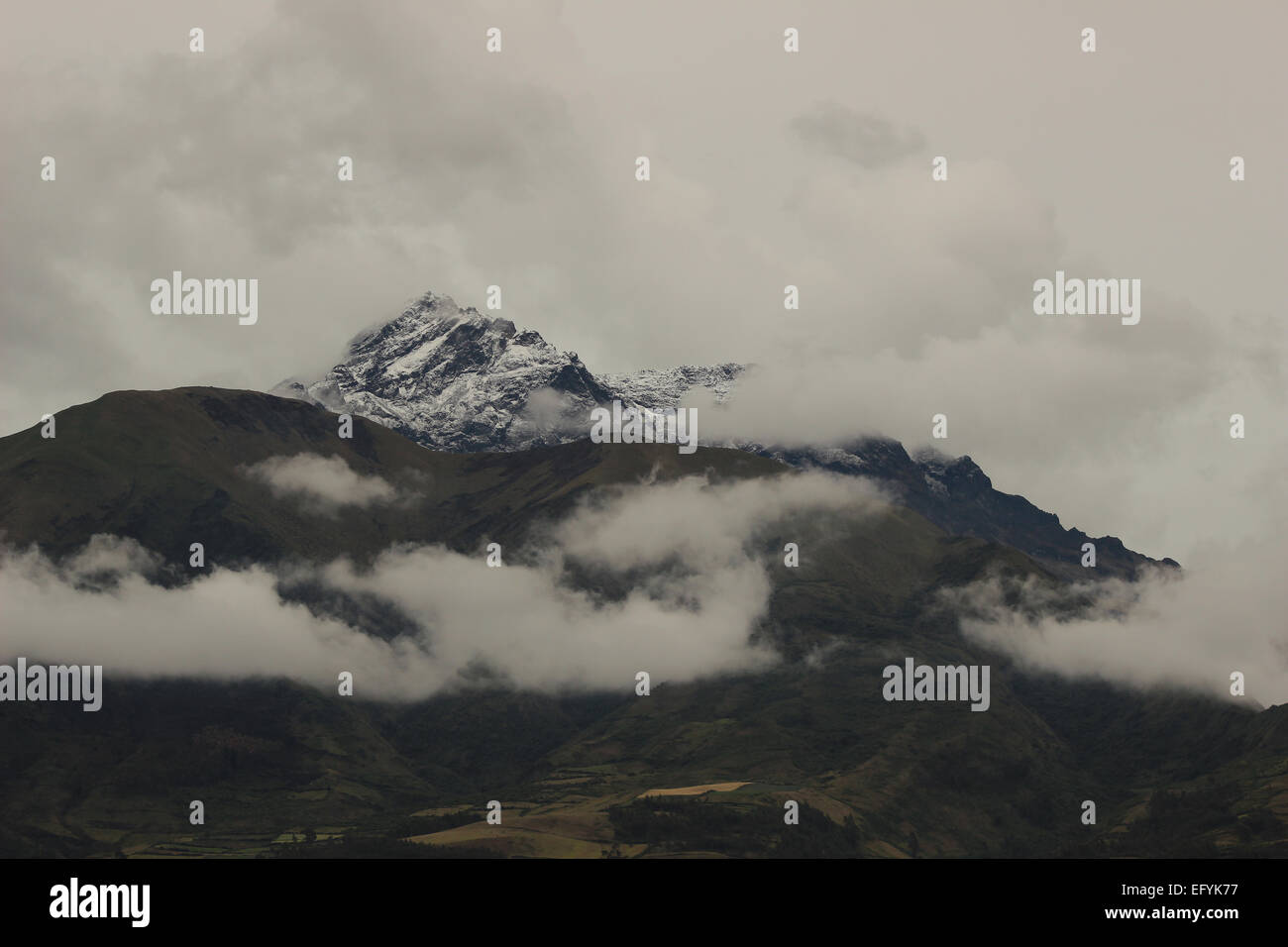 The snow covered peak of the dormant volcano, Mount Cotacachi, near ...