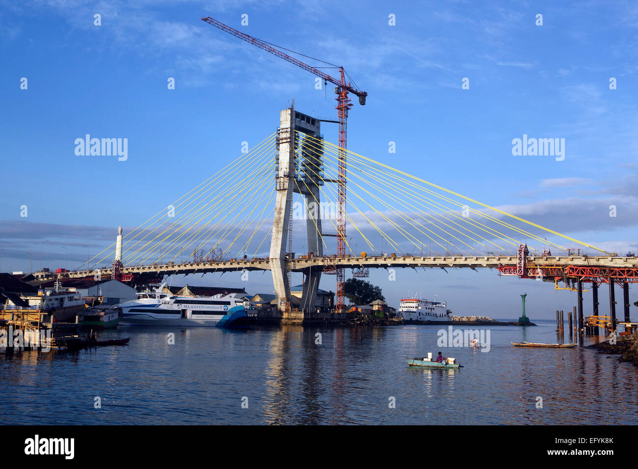 Bridge building construction over the Manado River Stock Photo - Alamy