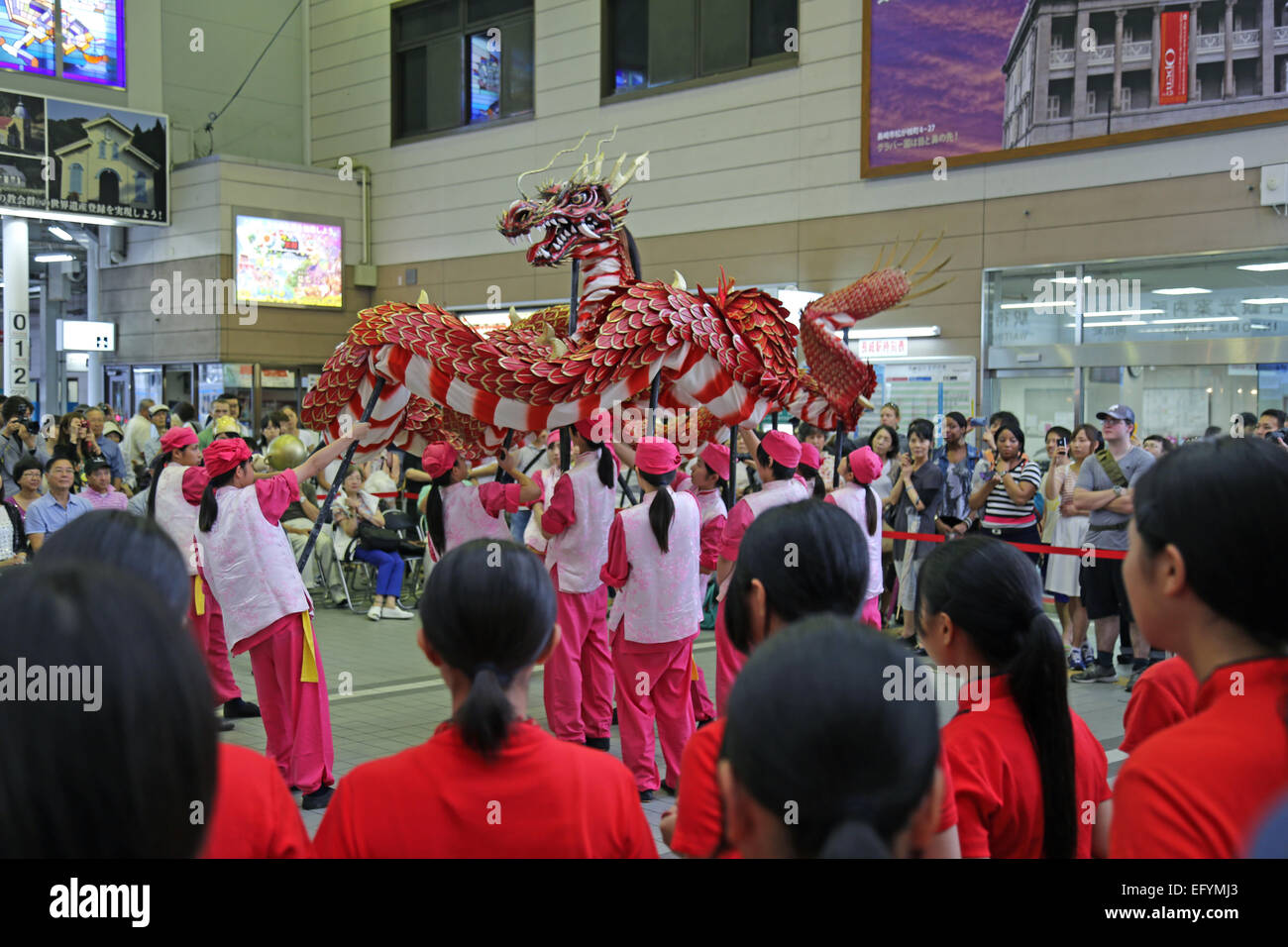 Japanese high school girls performing a Chinese Dragon Dance ceremony ...