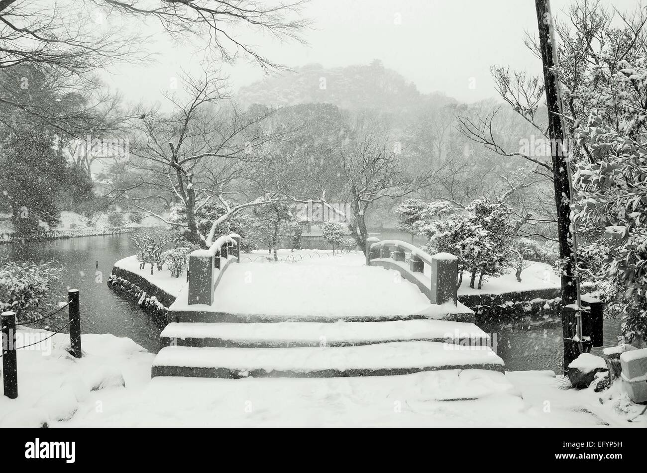 A Japanese Bridge covered in Snow Stock Photo - Alamy