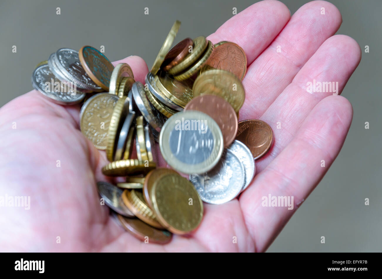 Coin in human hand hi-res stock photography and images - Alamy