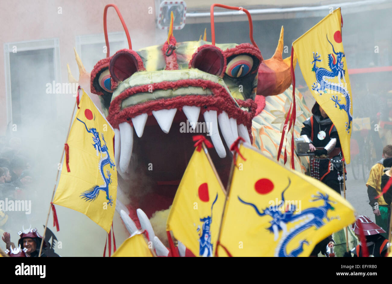 A group of Carnival fools participates with a Chinese dragon in the ...