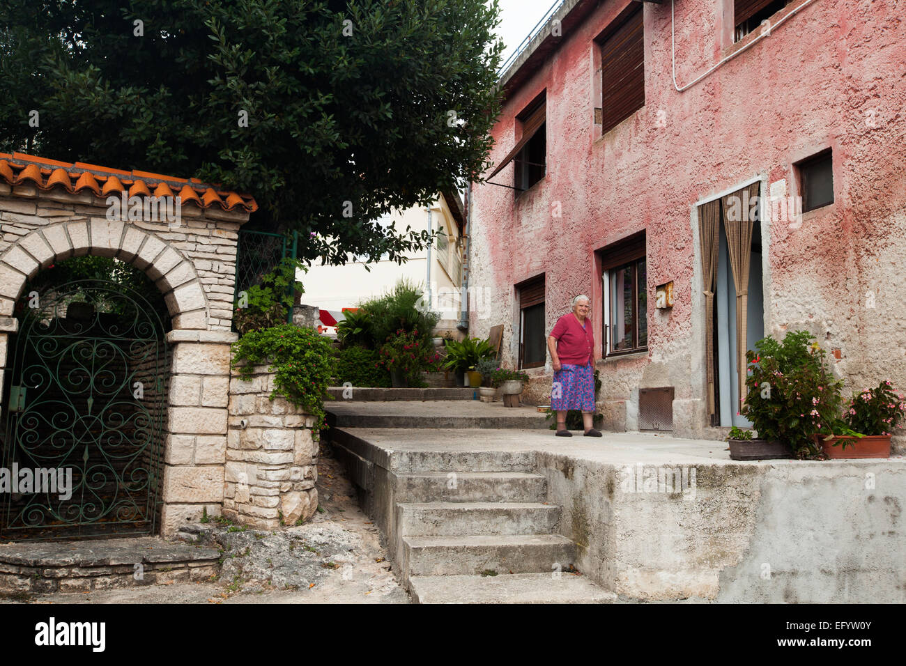 Grandma on a porch in croatia Stock Photo - Alamy