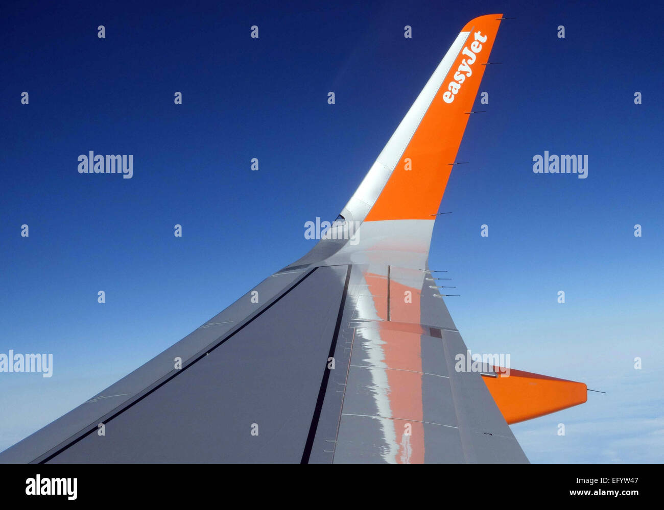 EasyJet logo on wingtip of Airbus A320 aircraft in flight Stock Photo ...