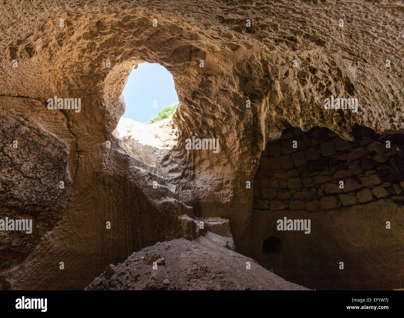 entrance into the cave, summer day Stock Photo - Alamy