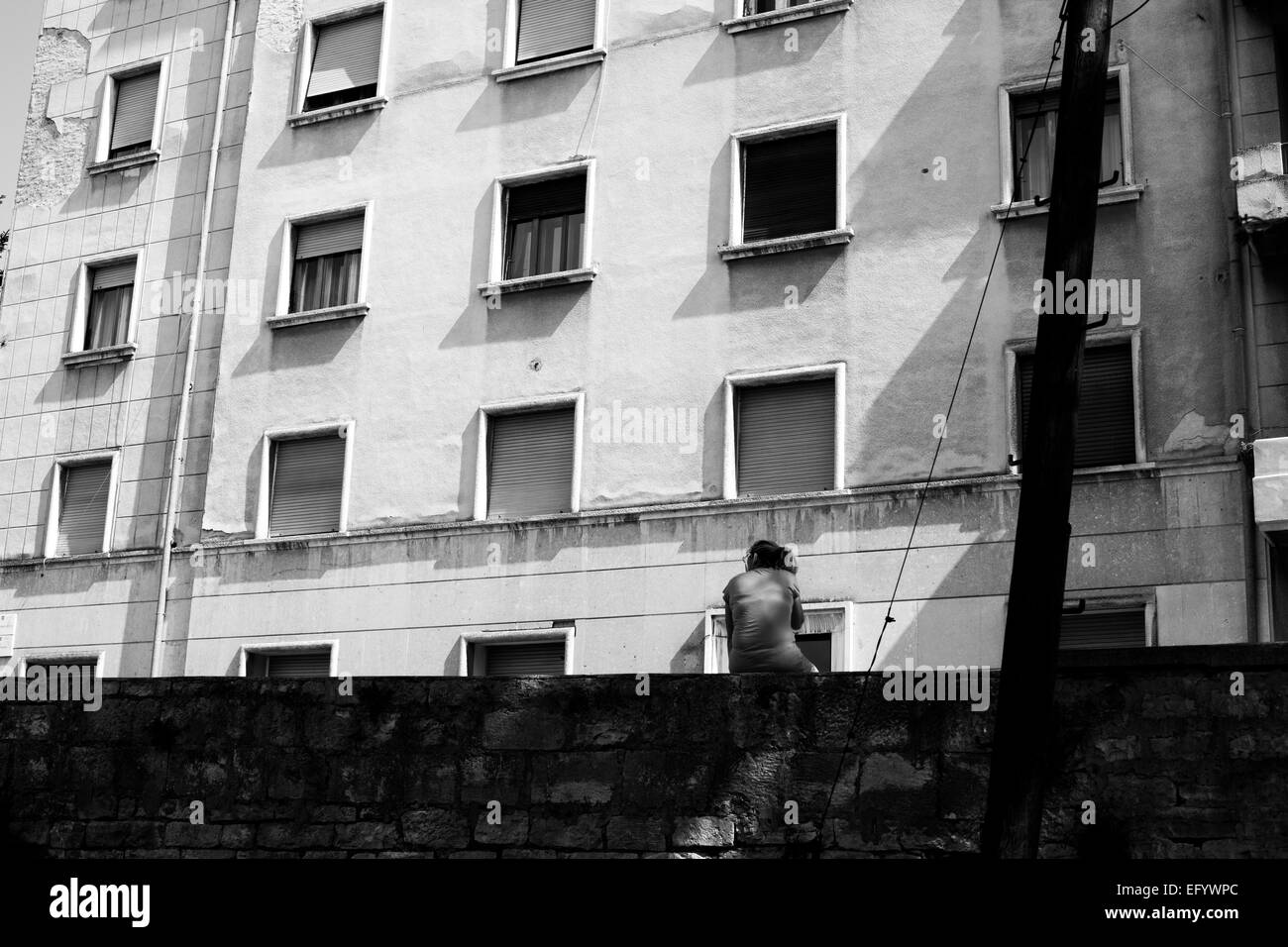 Man sitting on window Black and White Stock Photos & Images - Alamy