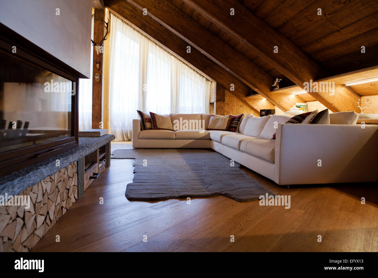 Prestigious luxury Alpine living room with modern corner white sofa and ...