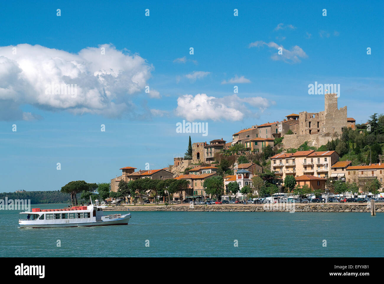 Village of Passignano and ferry in Lake Trasimeno, Umbria, Italy ...