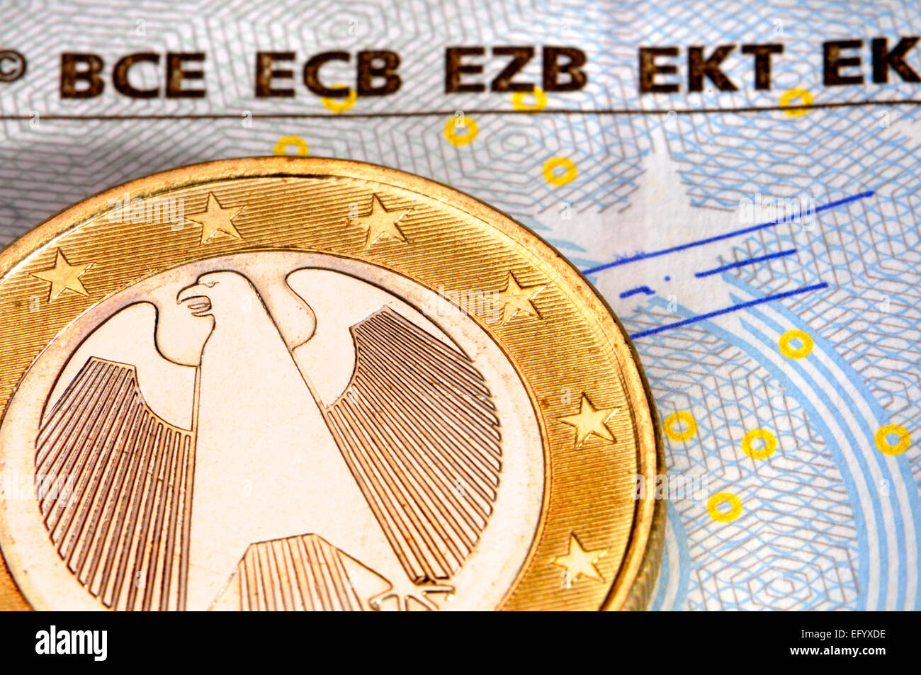 German 1 Euro coin on a €5 note Stock Photo - Alamy