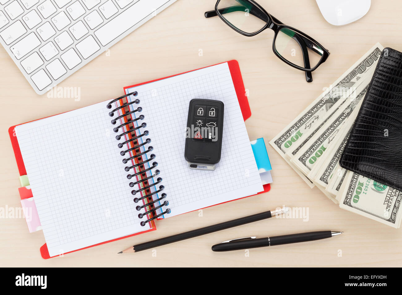 Office table with pc, supplies and money cash. View from above with ...