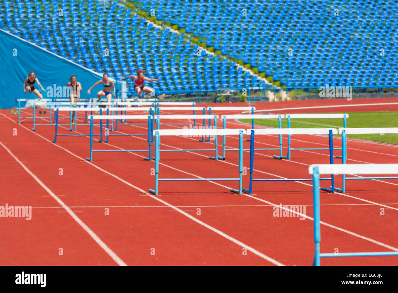 athletes race with obstacles, sports background Stock Photo - Alamy
