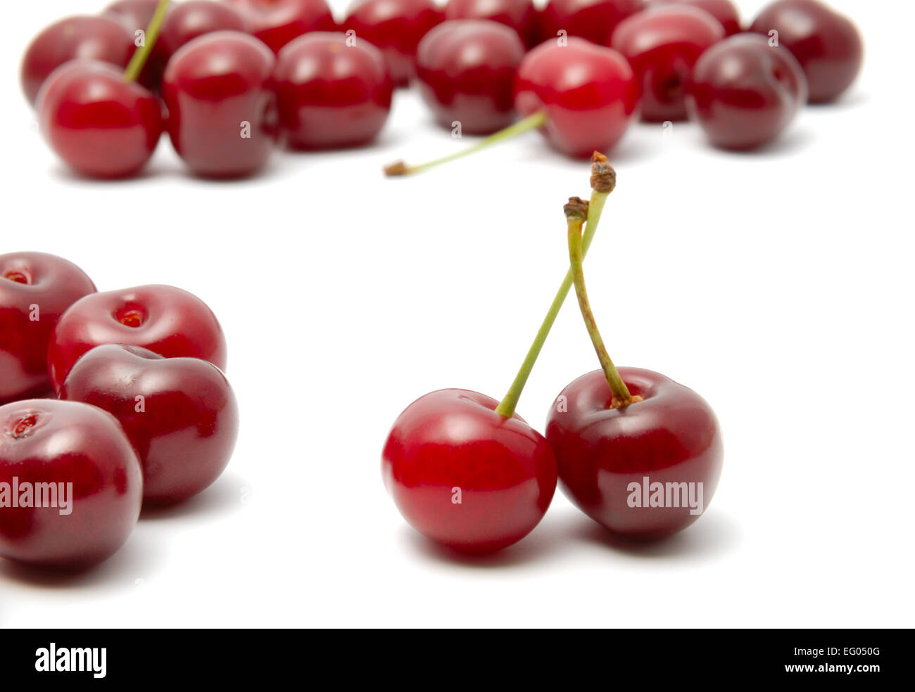 Red ripe cherry on a white background Stock Photo - Alamy