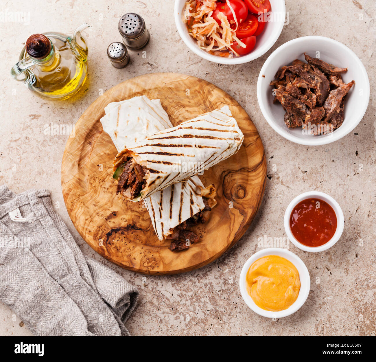 Doner Kebab grilled meat and vegetables on stone textured background ...