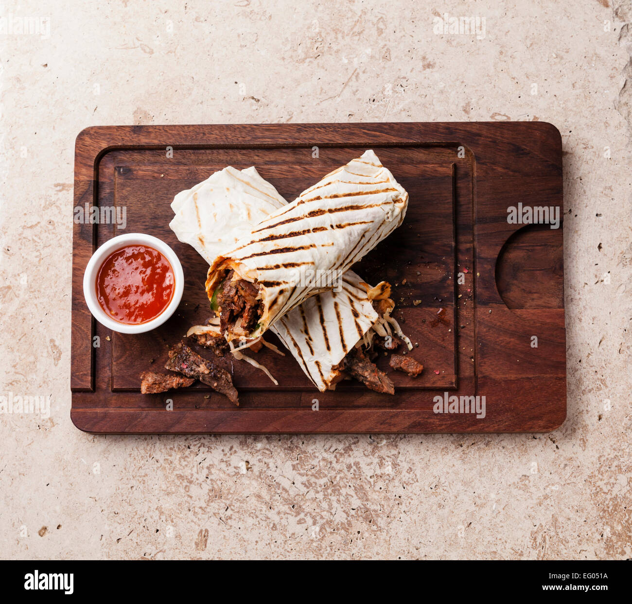 Doner Kebab grilled meat and vegetables on stone textured background ...
