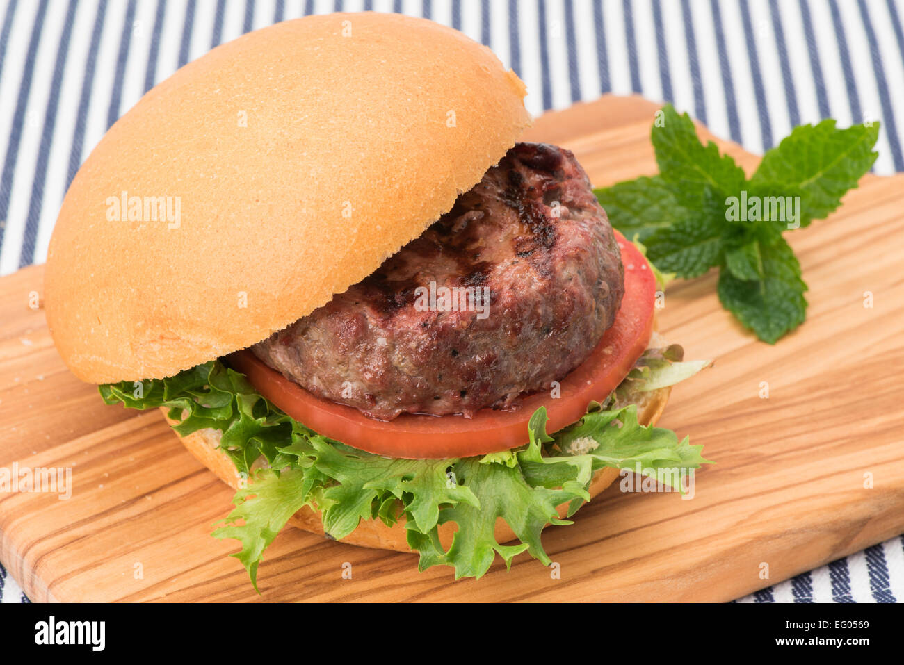 Burger in a bun - studio shot Stock Photo - Alamy