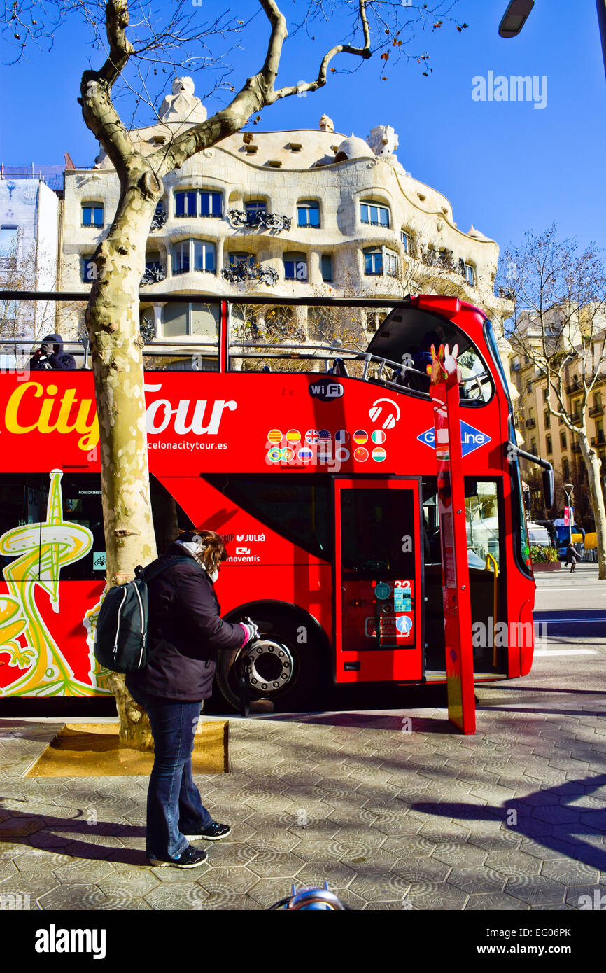 Barcelona city tour bus in a front of Mila house aka La Pedrera ...