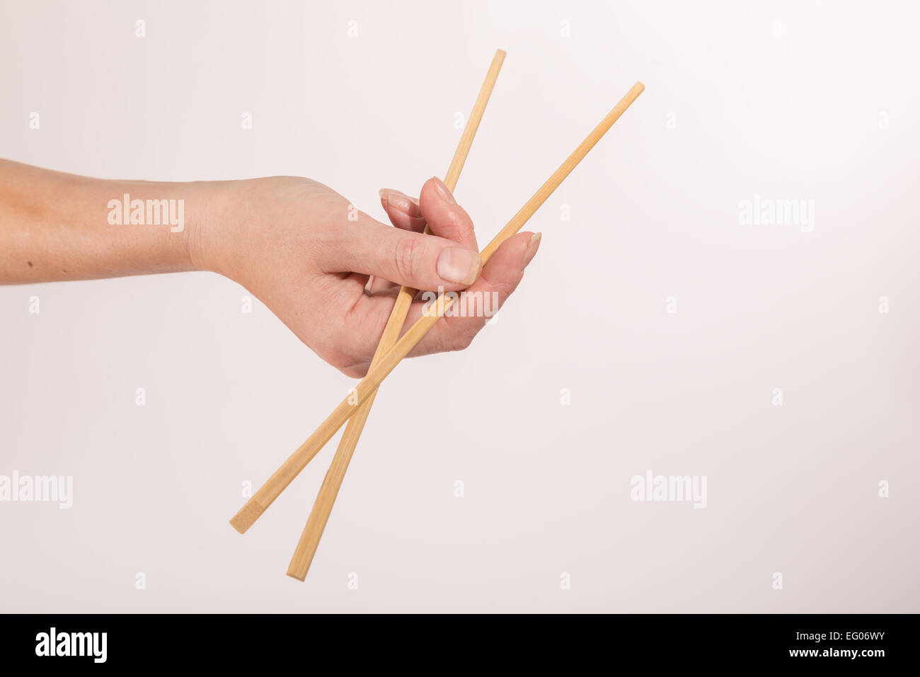 female hand with chopsticks Stock Photo - Alamy