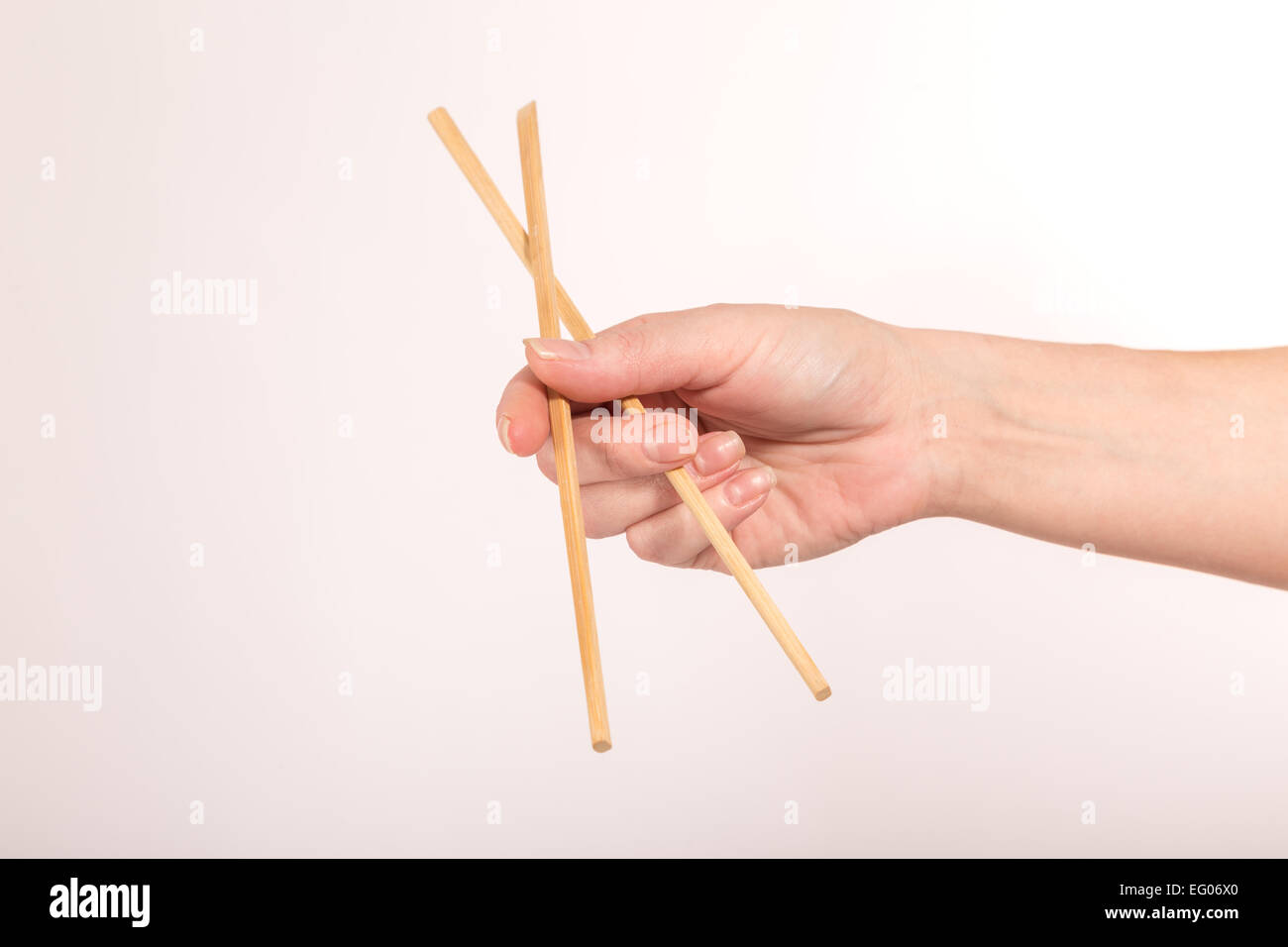 female hand with chopsticks Stock Photo - Alamy