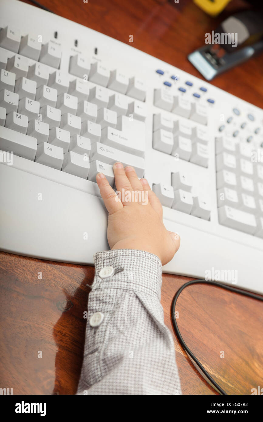 Happy childhood. Closeup of hand of smart little boy child kid on the ...