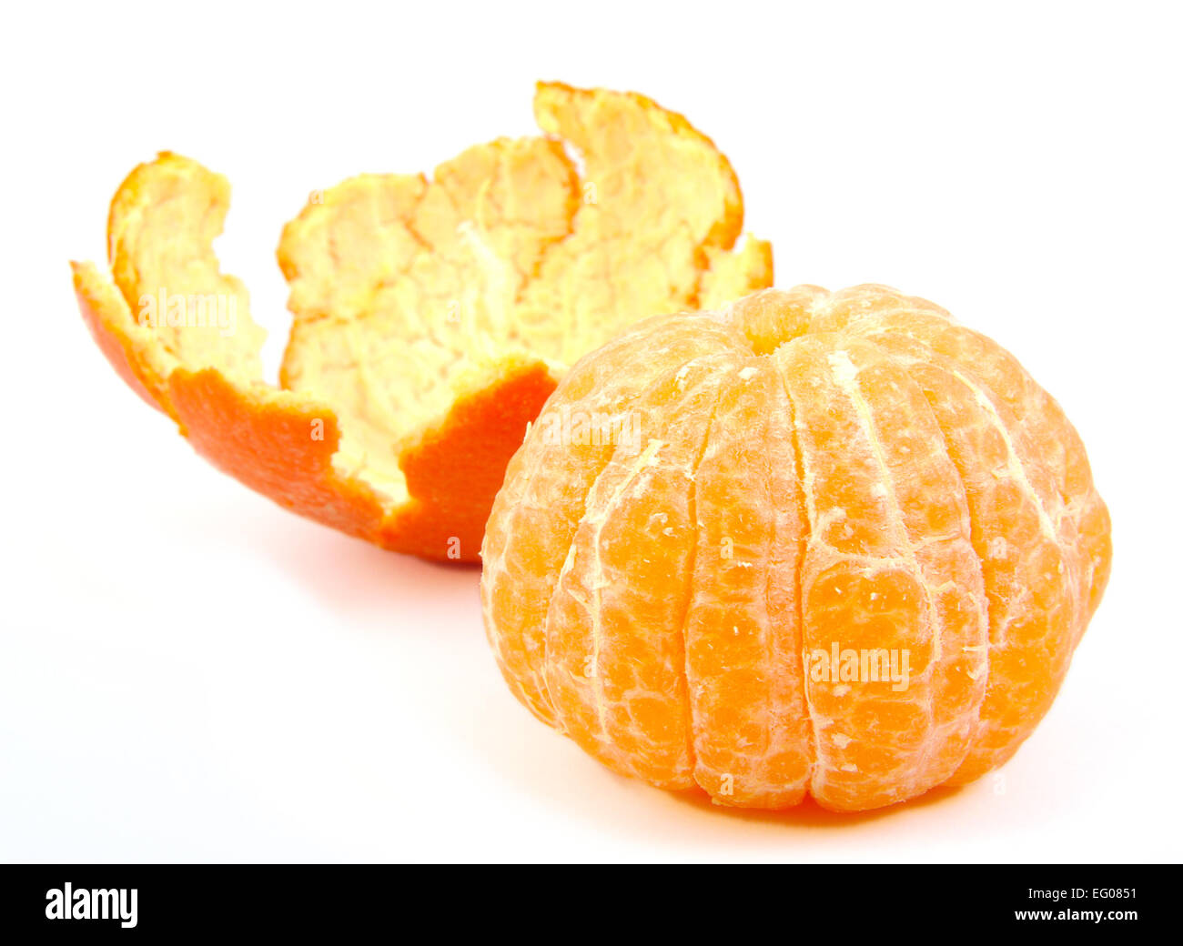 Single peeled tangerine or mandarin fruit with its skin on white ...