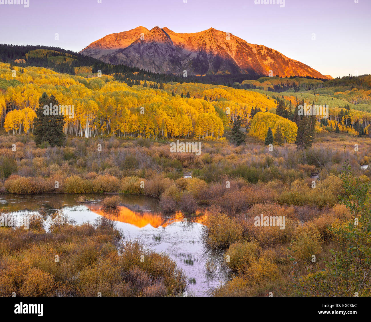 Gunnison National Forest, West Elk Mountains, CO: Sunrise light on East ...