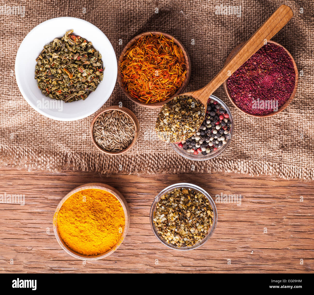 set dry spices in a wooden bowl on a vintage background Stock Photo - Alamy