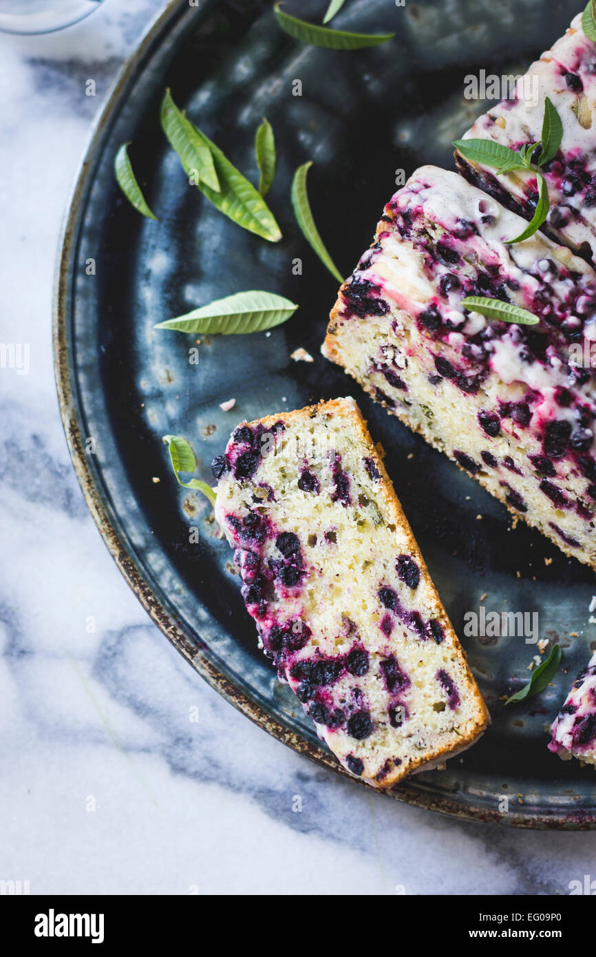 Iced berry cake with lemon verbena leaves Stock Photo - Alamy