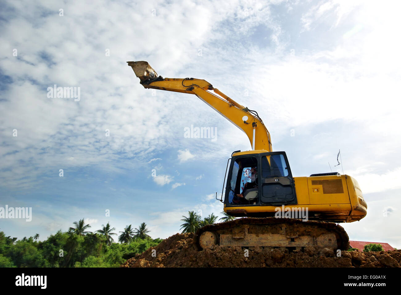 excavator and backhoe on sky background Stock Photo - Alamy