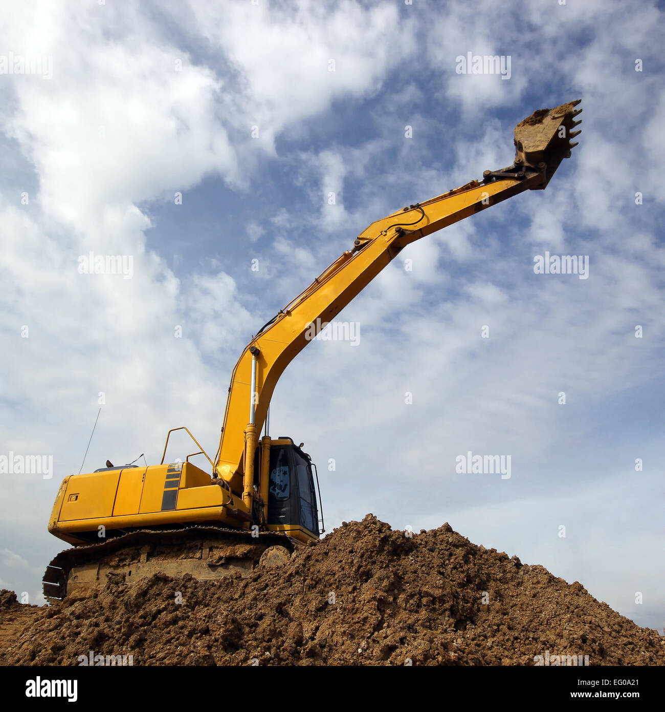 excavator and backhoe on sky background Stock Photo - Alamy