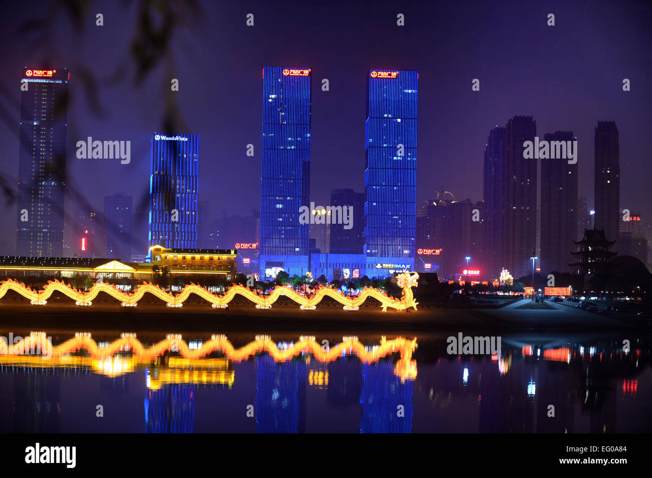Changsha. 12th Feb, 2015. A dragon-shaped light illuminates the ...