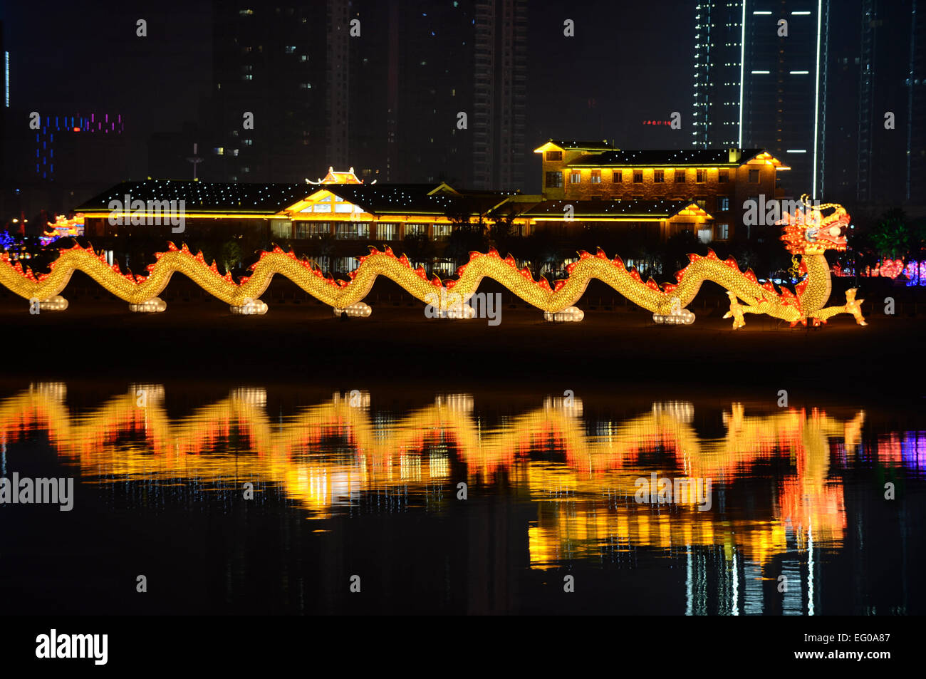 Changsha. 12th Feb, 2015. A dragon-shaped light illuminates the ...