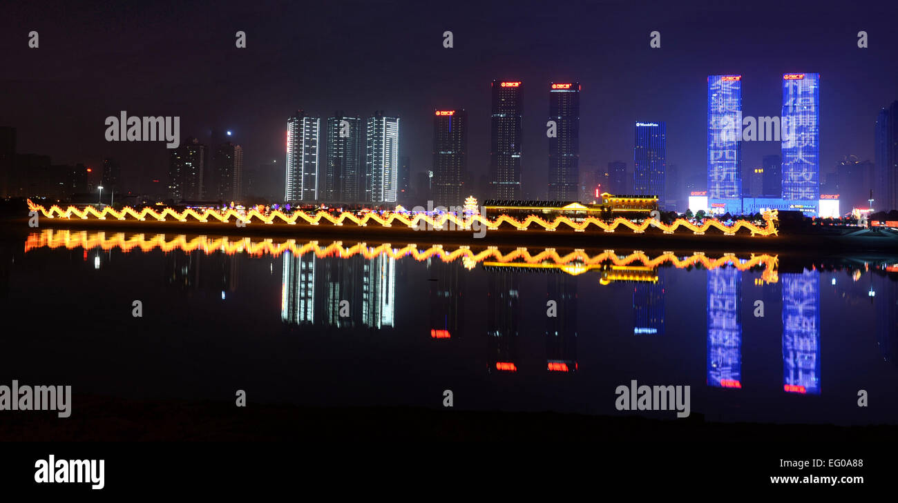 Changsha. 12th Feb, 2015. A dragon-shaped light illuminates the ...