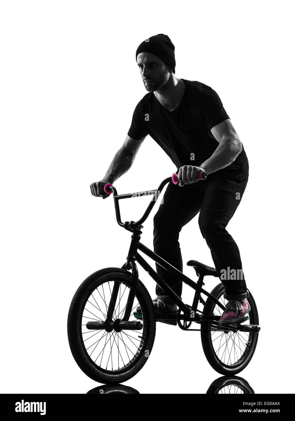 one man exercising bmx acrobatic figure in silhouette studio isolated ...