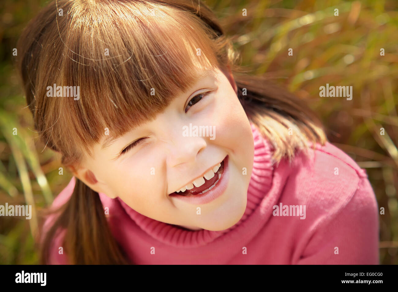 Portrait of cheerful girl Stock Photo - Alamy