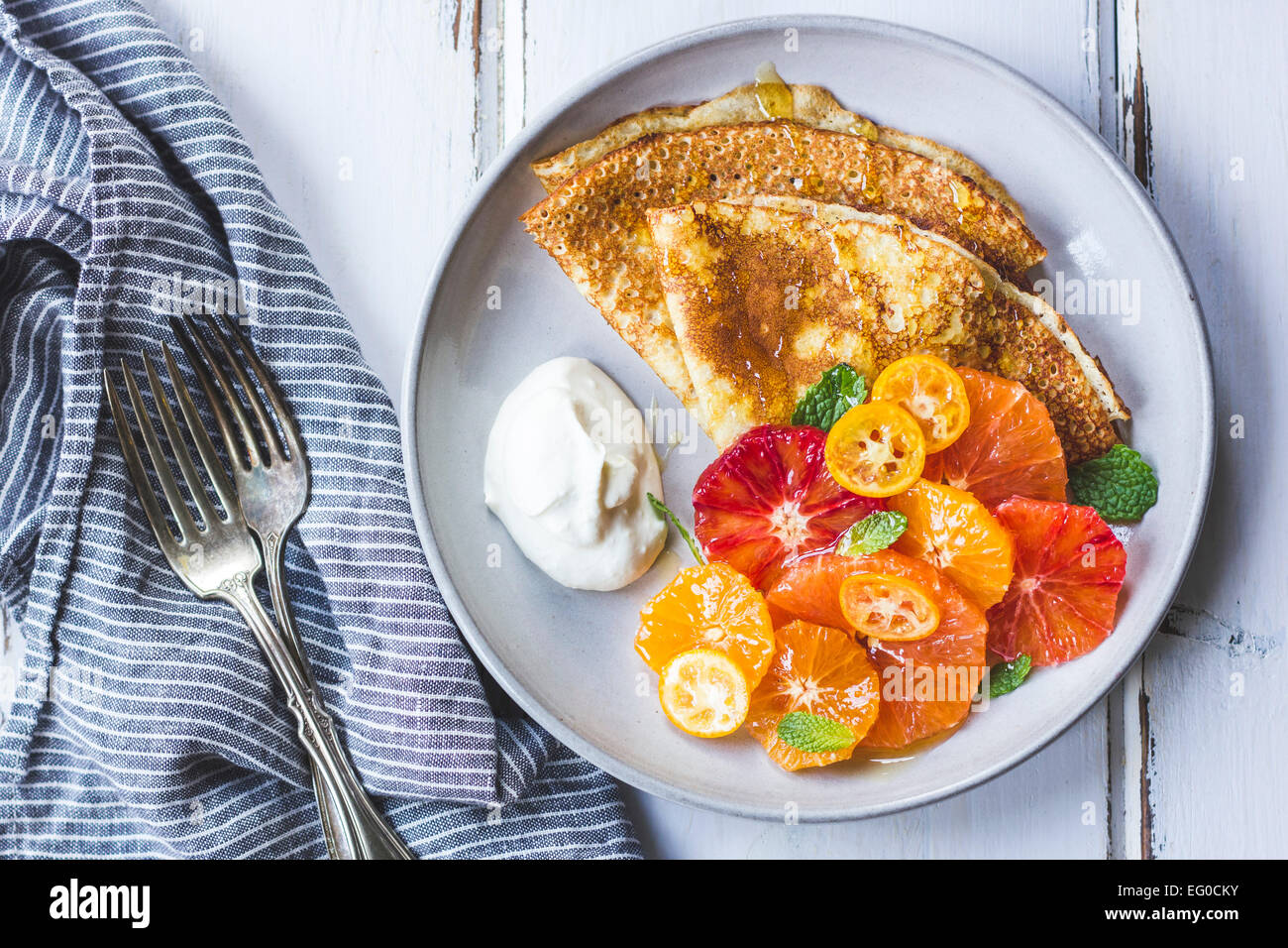 Crepes with a citrus fruit side Stock Photo - Alamy
