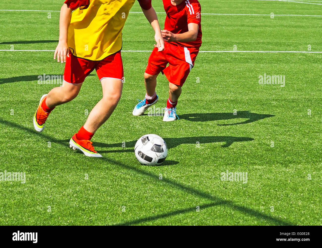 Young soccer players in action Stock Photo - Alamy