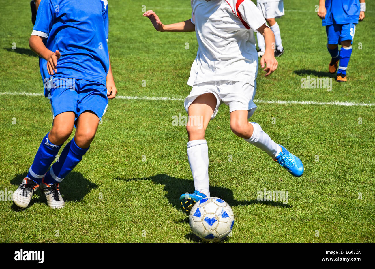 Young soccer players in action Stock Photo - Alamy