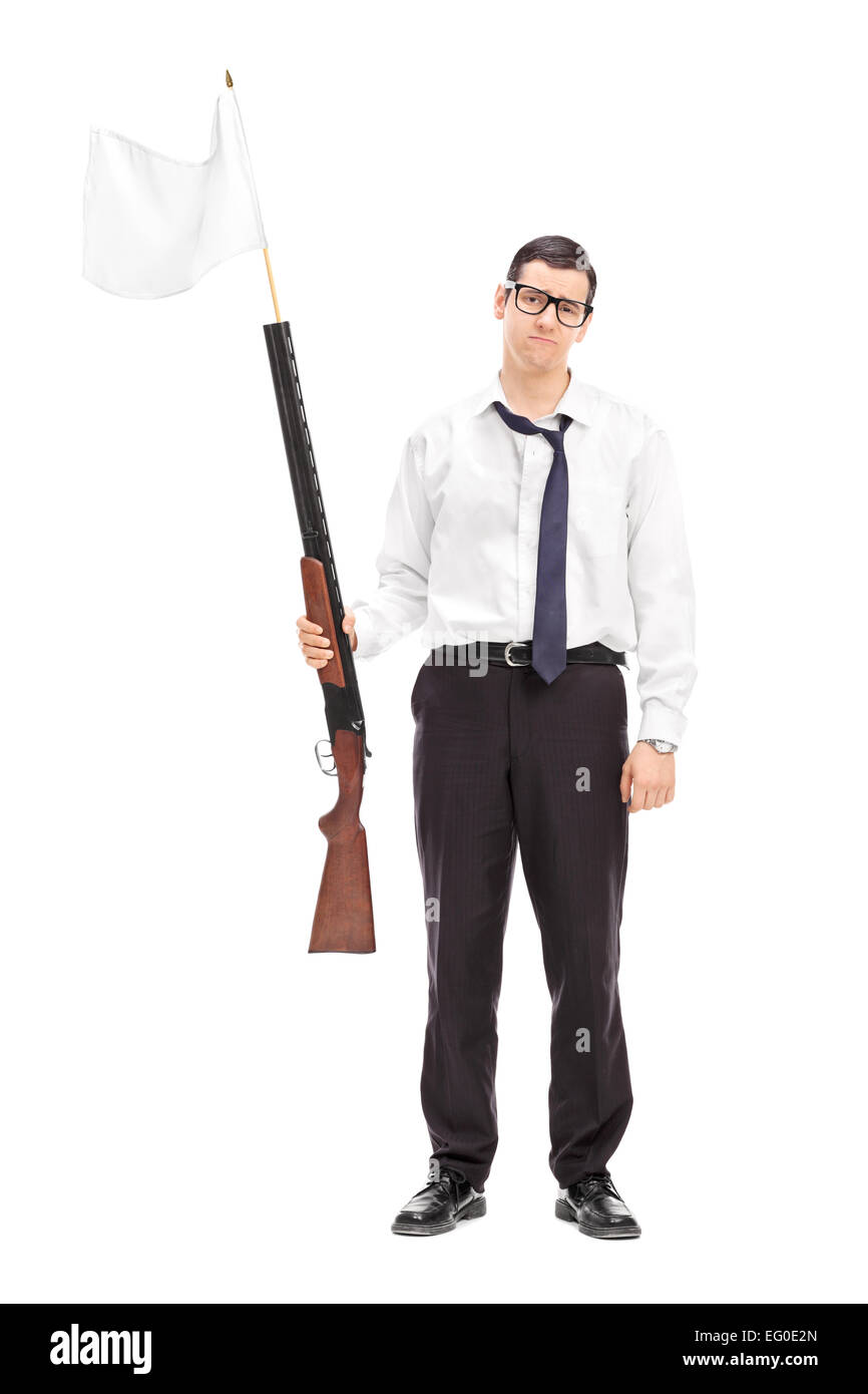 Full length portrait of a sad guy holding a rifle with white flag ...