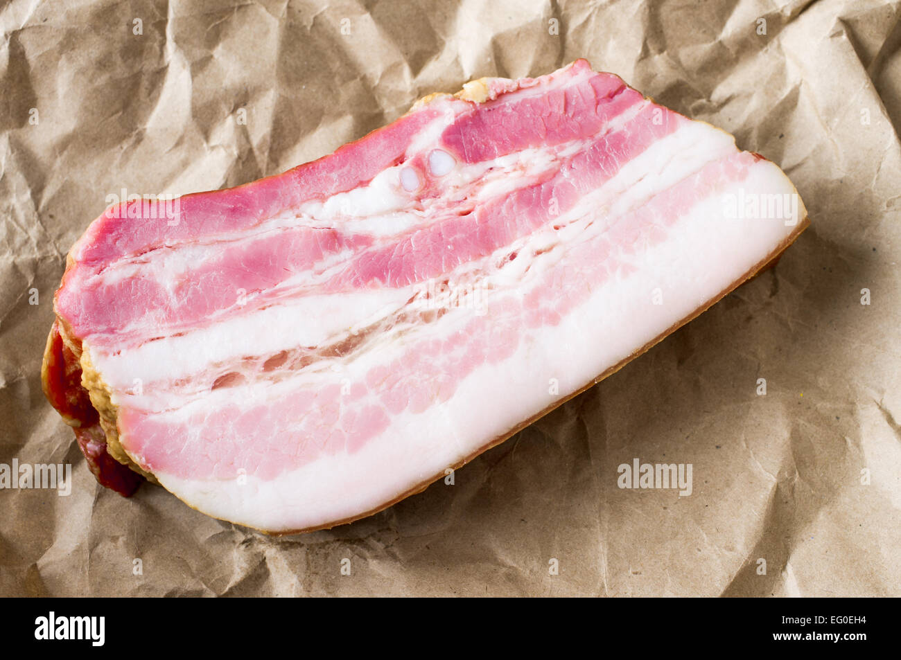 Smoked bacon in one piece Stock Photo - Alamy