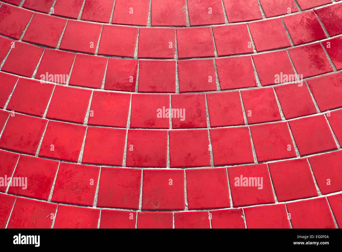 Detail of a red tile floor with arch motif Stock Photo - Alamy