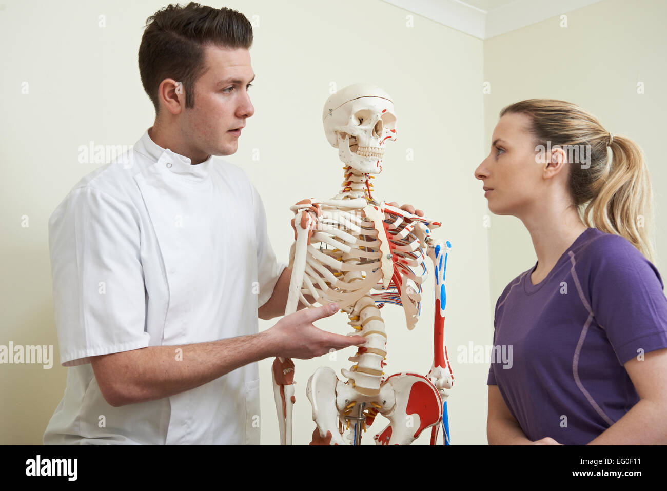 Female Patient In Consultation With Osteopath Stock Photo - Alamy