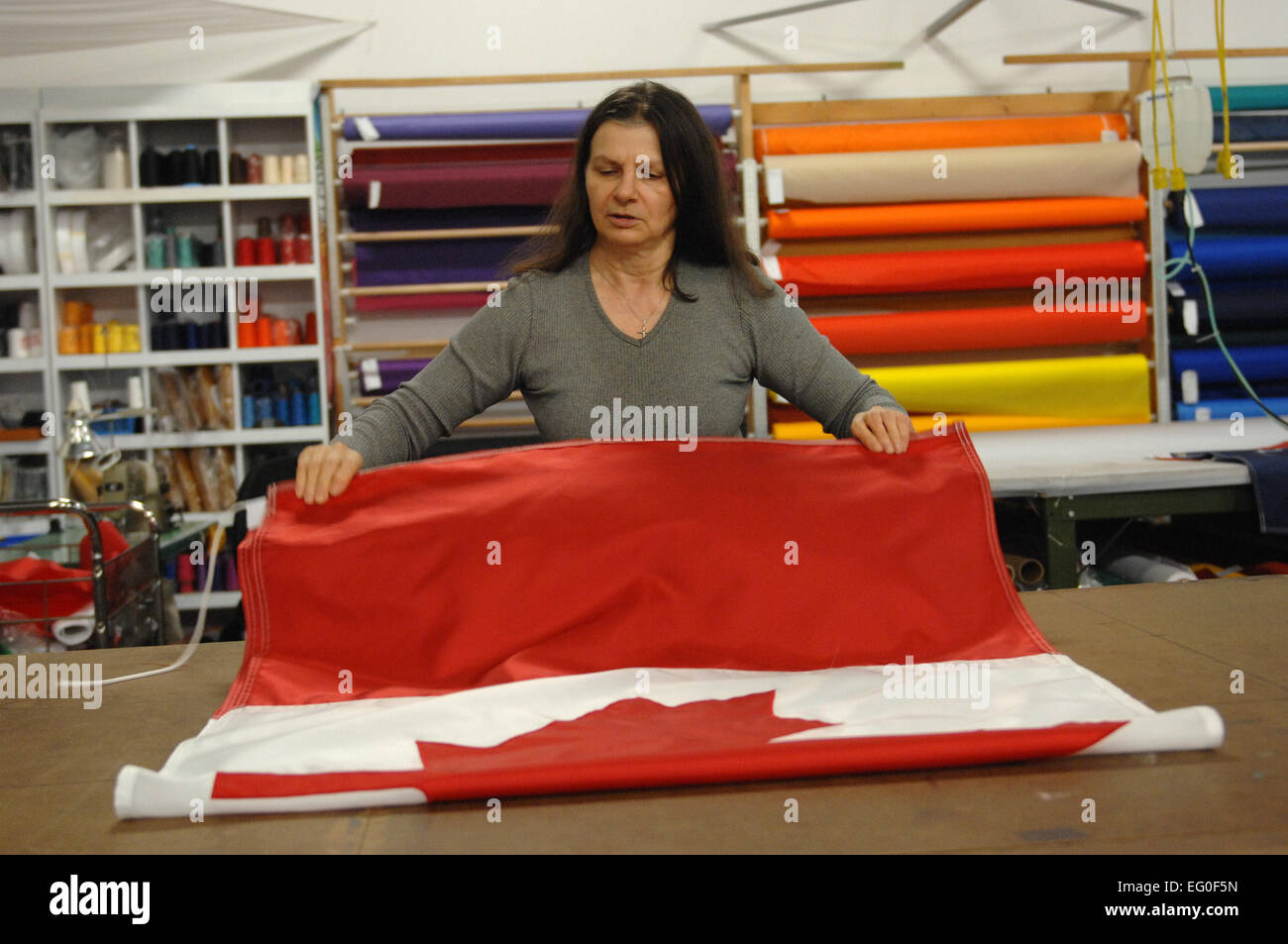 Vancouver, Vancouver Feb. 12. 15th Feb, 1965. Flag Shop employee Hannah ...