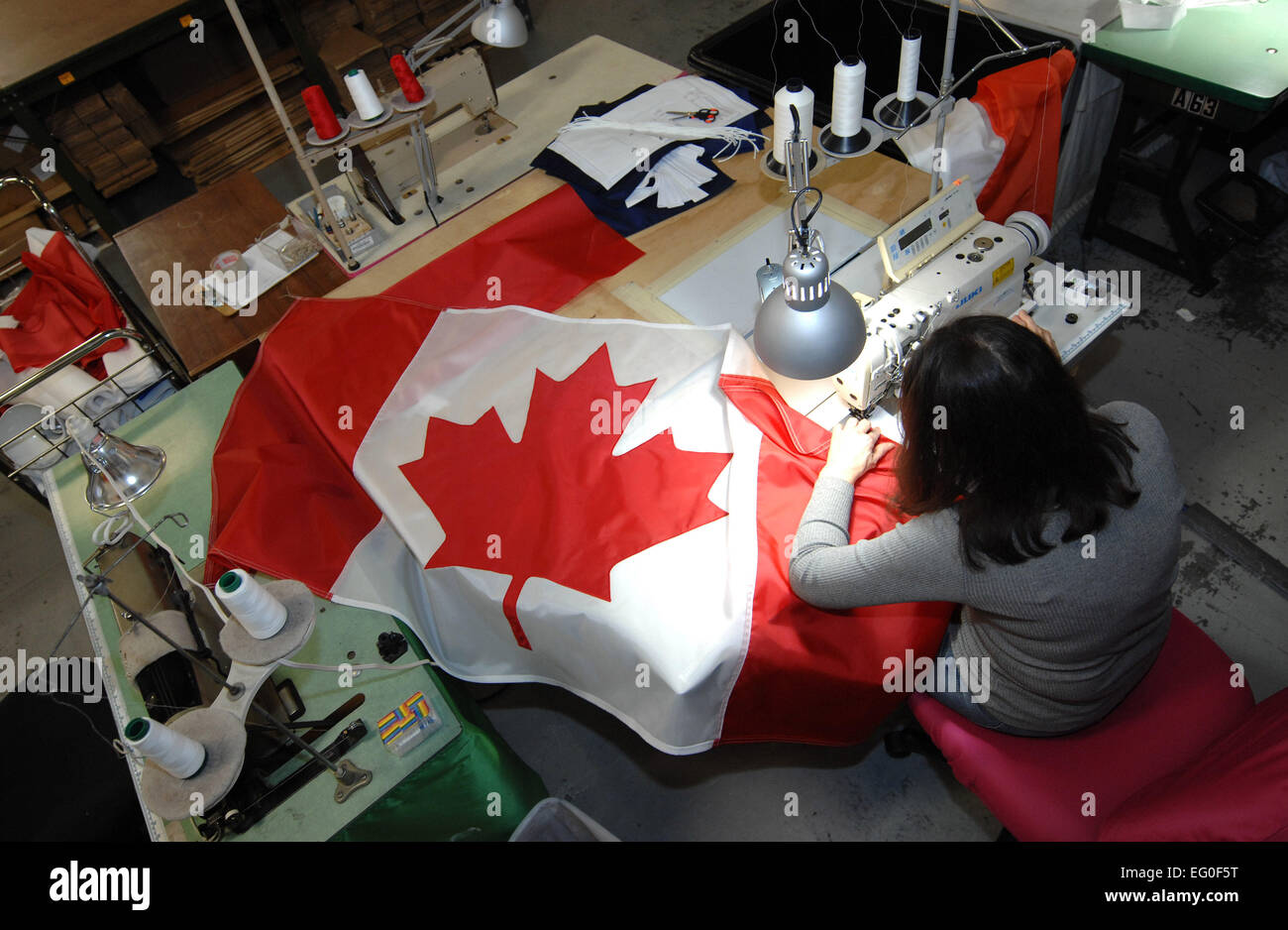 Vancouver, Vancouver Feb. 12. 15th Feb, 1965. Flag Shop employee Hannah ...