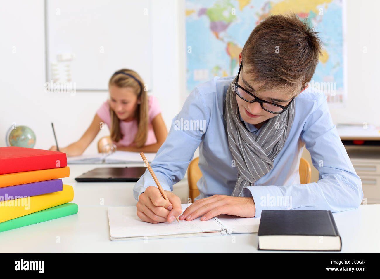 Photo of two students in their class writing in their notebooks Stock ...
