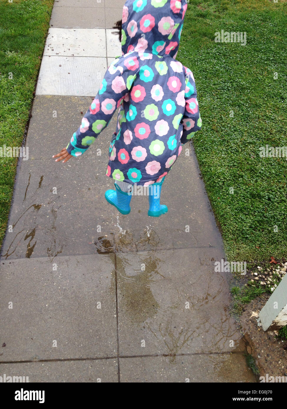 Girl splashing puddle hi-res stock photography and images - Alamy