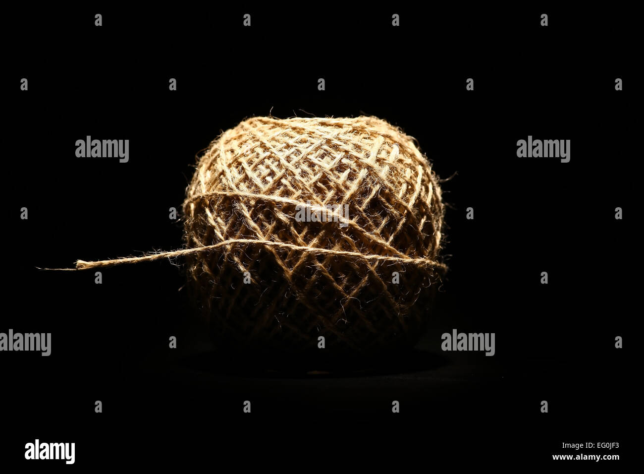 Color shot of a rope ball on black background Stock Photo - Alamy