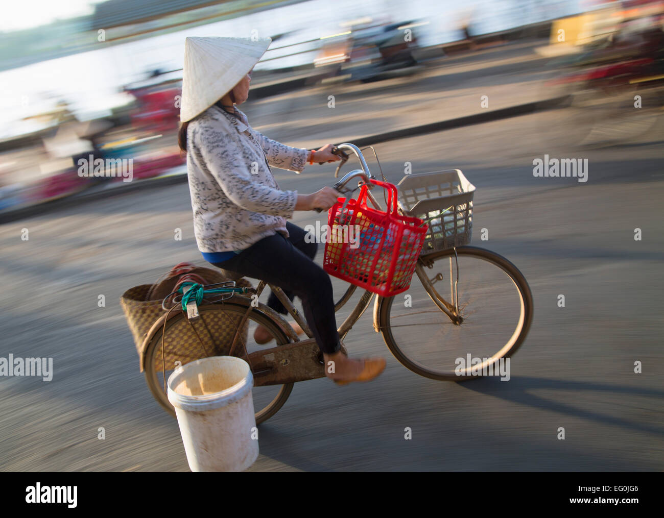 Vietnamese woman cycling hi-res stock photography and images - Alamy